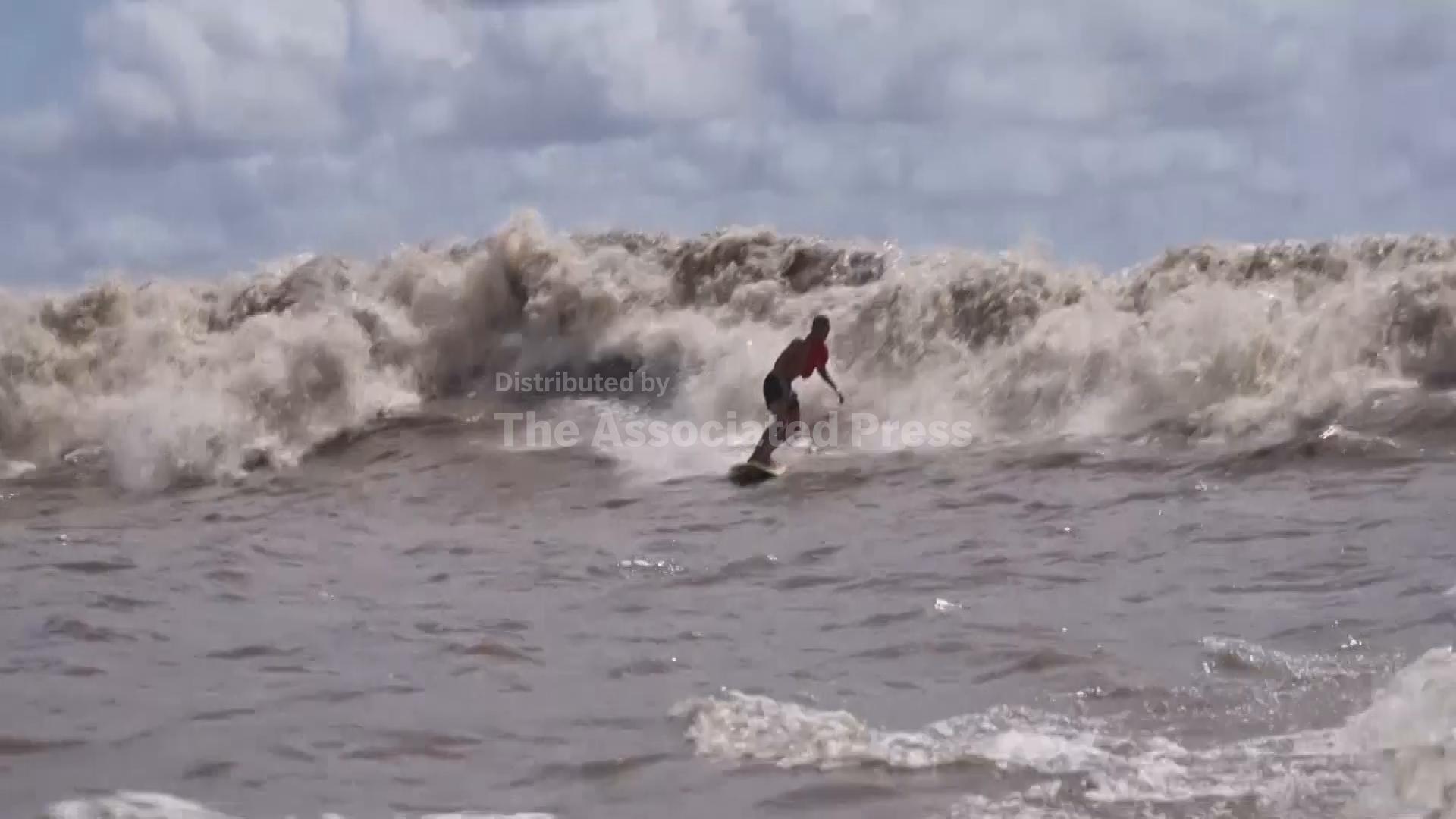 Surfers at Amazon's mouth ride some of world's longest-lasting waves ...