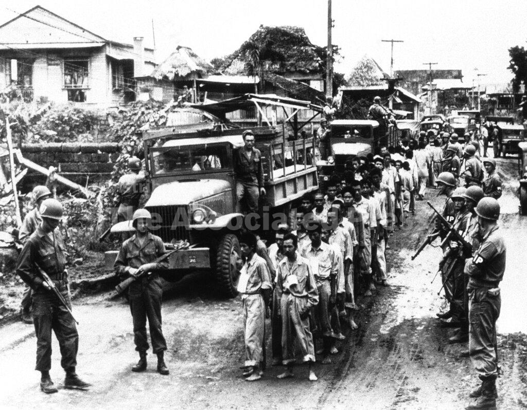 THIS DAY. Military police of the 38th Cyclone Infantry Division stand ...