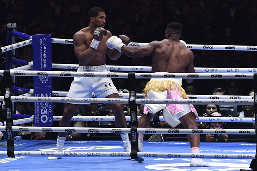 Anthony Joshua knocks out MMA star Francis Ngannou in the 2nd round of a one-sided boxing match ...