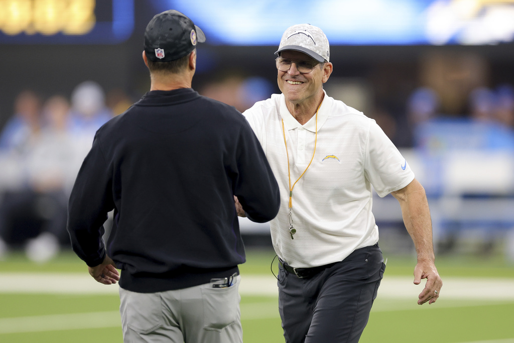 Harbaugh brothers share hug at midfield before facing each other for ...