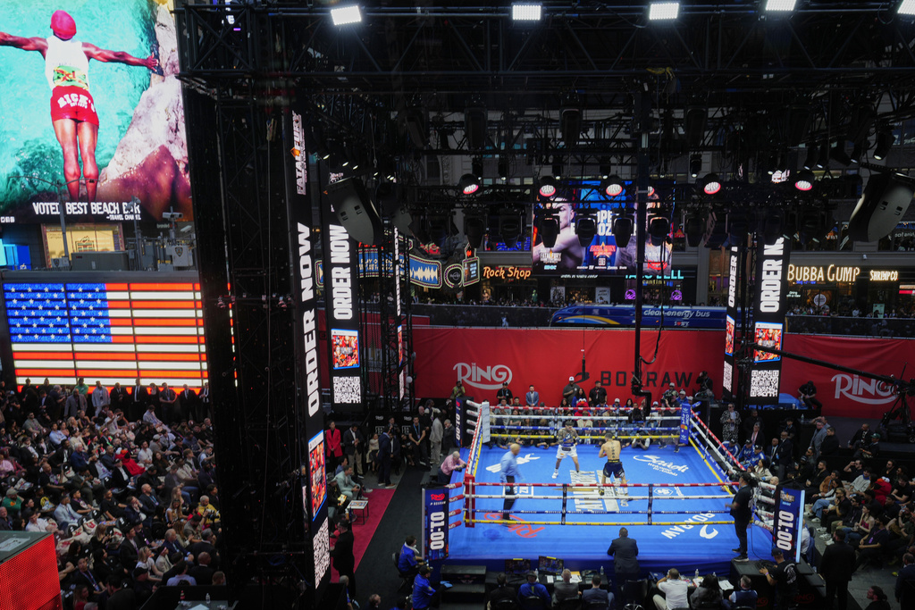 Times Square boxing event sees Teofimo Lopez defend his title, with ...