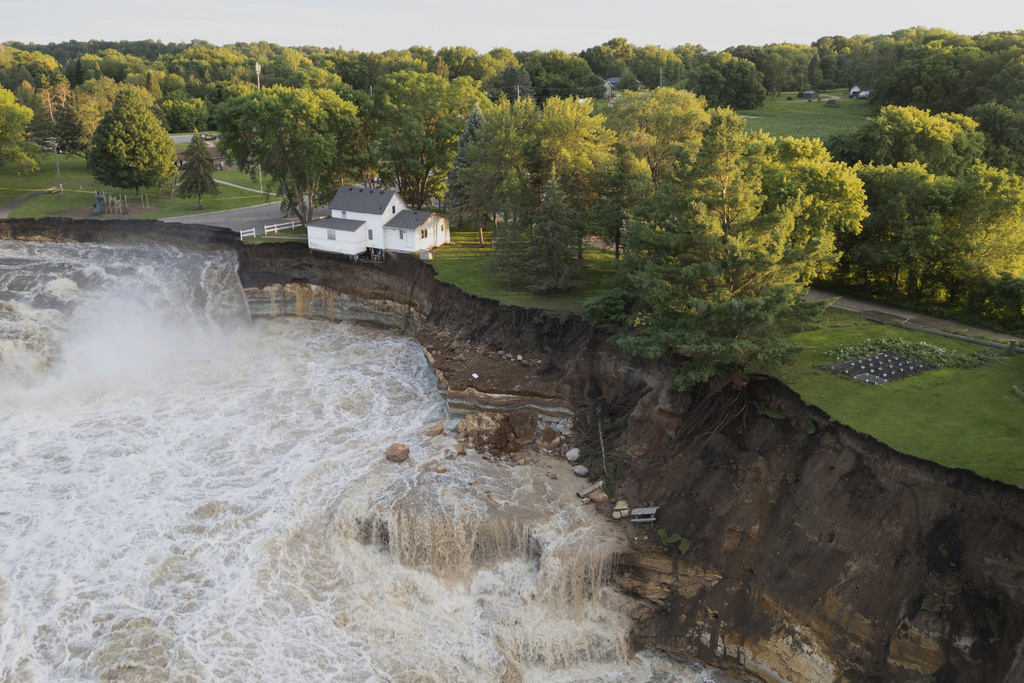 Minnesota family store is demolished from its perch near dam damaged by ...
