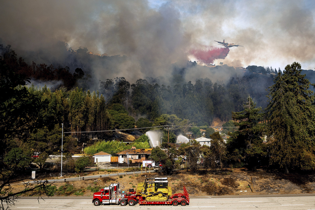 A fast-moving brush fire in California burned 2 homes while others were ...