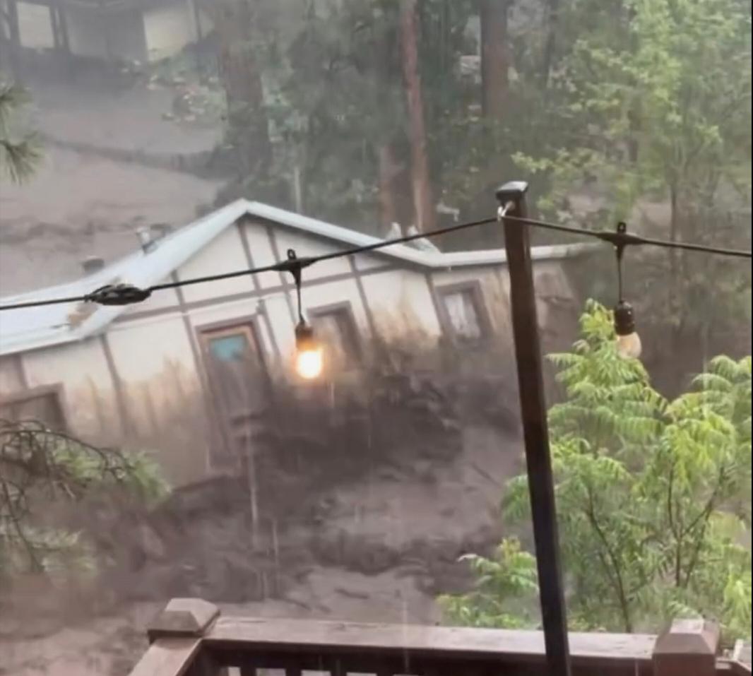 An entire house swept downstream in New Mexico floods seen as a symbol ...