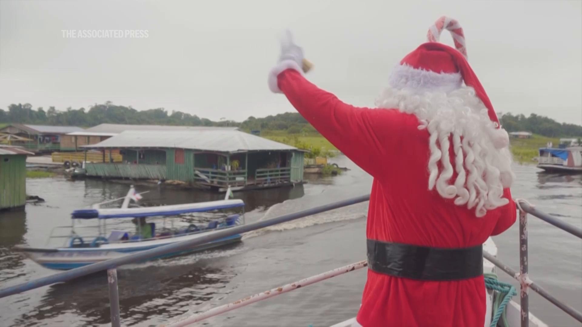 Santa braves the sticky heat of the Amazon jungle to bring gifts to ...