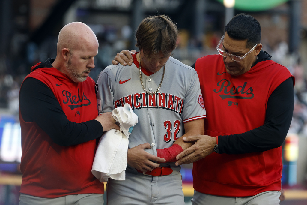 Reds rookie Tyler Callihan injures arm trying for catch on inside-the ...